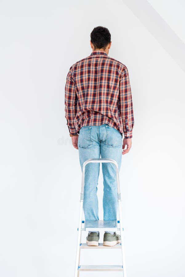 View of Man Standing at Ladder and Looking at Wall Isolated on White ...