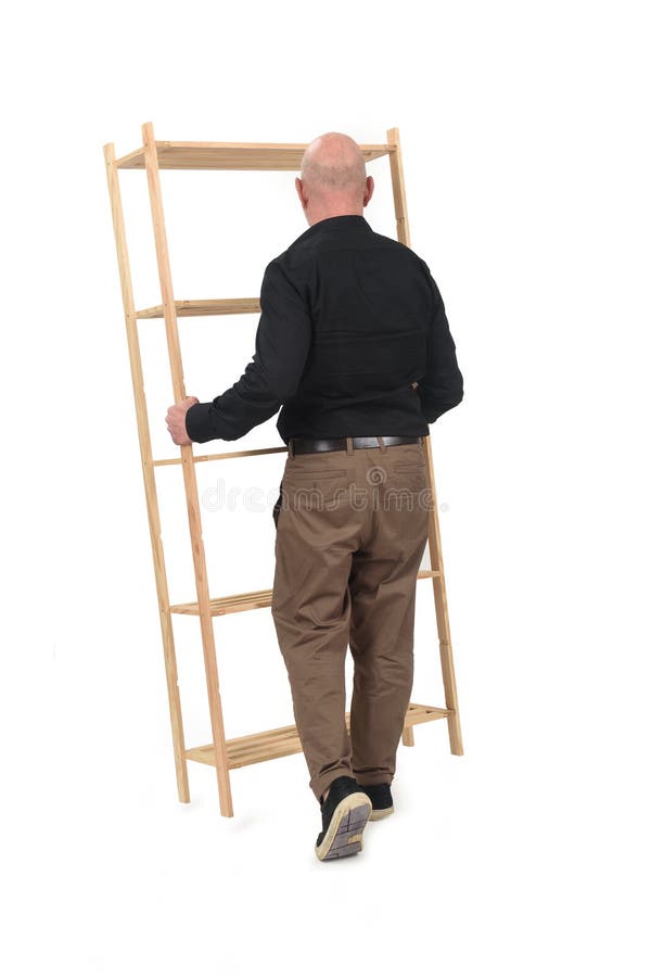 Two Men Carrying Shelf stock photo. Image of furniture - 222462788