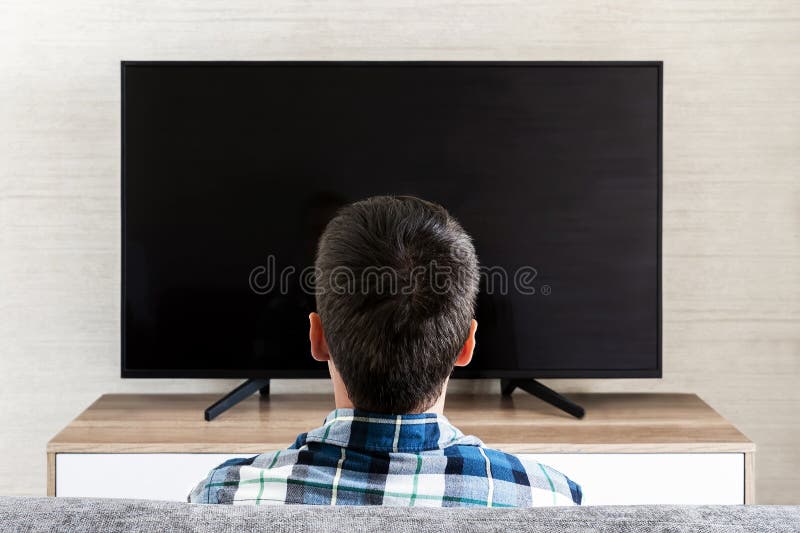 Man Watching Television, Turning on Plasma Flatscreen TV-set, Pointing ...
