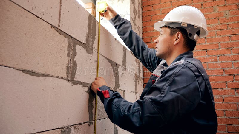 Man Measuring Length of Window in Building Stock Photo - Image of ... Man Measuring Length of Window in Building Stock Photo - Image of ...