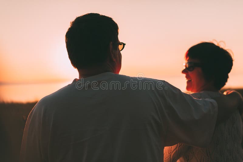 Back View a Married Couple a Silhouette Sitting on a Bench. Stock Image ...