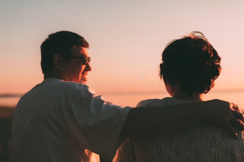 Back View a Married Couple a Silhouette Sitting on a Bench. Stock Image ...
