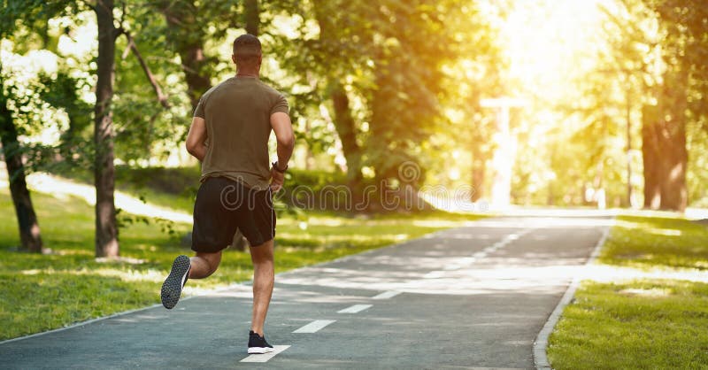 Back View of Millennial Sprinter on His Morning Run at Park on Sunny ...
