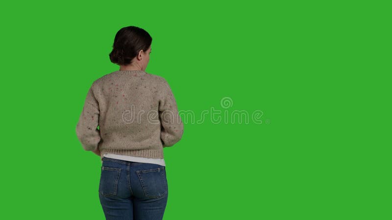 Back View of Model Being Displeased and Pushing Something Sideways ...