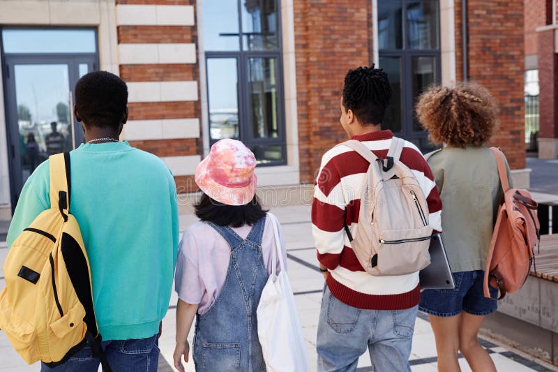 Back View of Multiethnic Group of Young Students Walking in Row ...