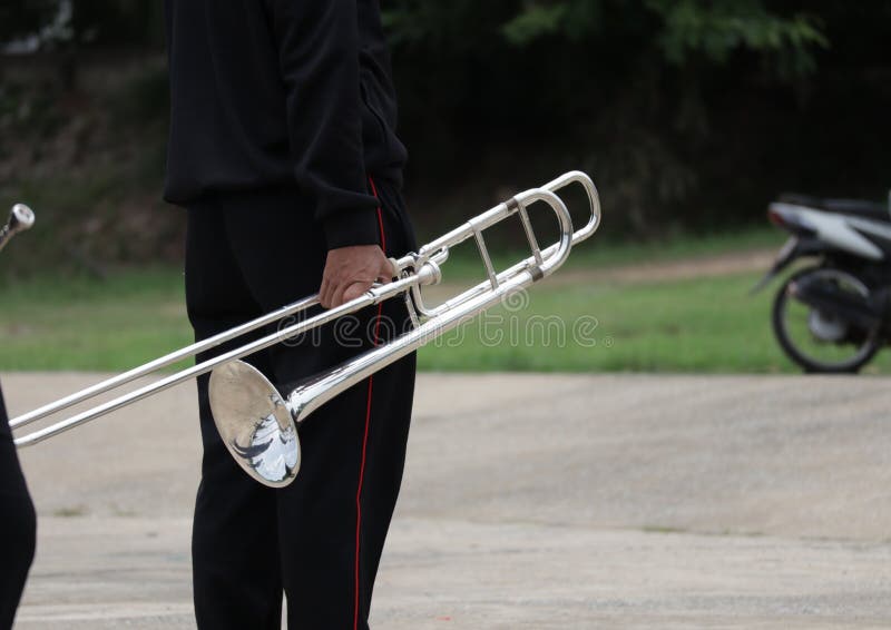 Back View of a Musician Holding a Trombone Instrument Outdoors Stock ...
