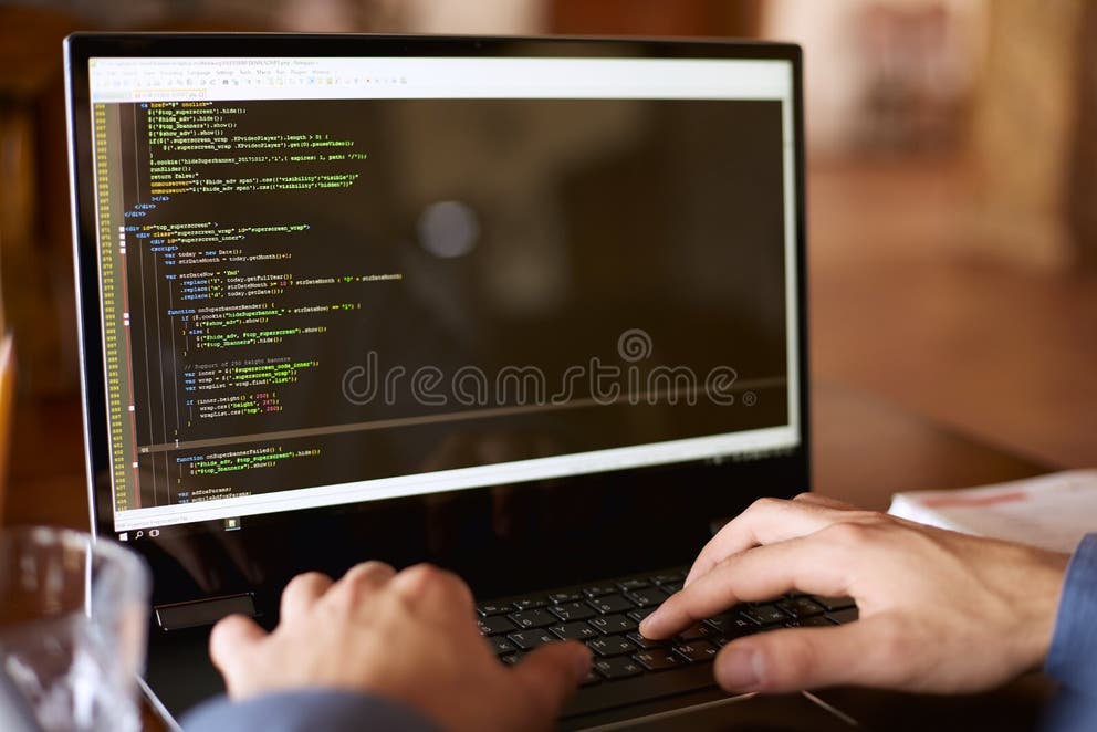 Back View Over the Shoulder Shot of Developer Programmer with Laptop ...