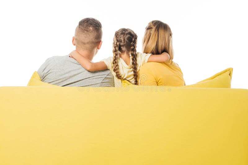 Back View of Parents and Daughter Sitting on Yellow Sofa Stock Photo ...