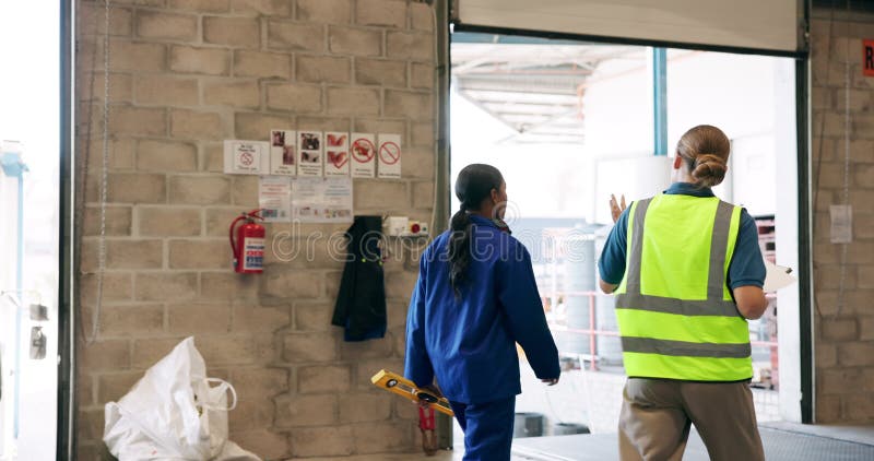 Back View, People and Meeting in Warehouse for Construction ...