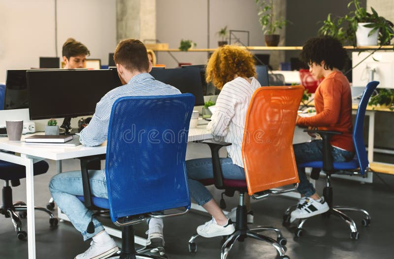 Back View of People Sitting at Table Working on Computers Stock Image ...