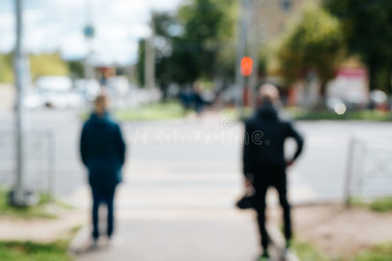 Back View People Stand at a Pedestrian Crossing in Front of a Red ...
