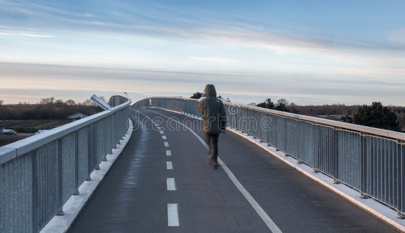 Back View of a Person Walking on a Bridge Road in Denmark Stock Image ...