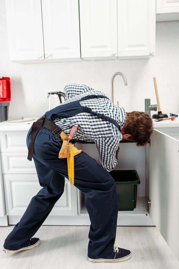 Back View of Plumber in Overalls Stock Photo - Image of maintenance ...