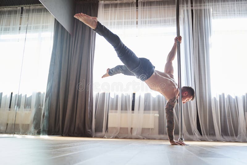 Attractive Young Man Dancing in Studio on Pylon Stock Photo - Image of ...