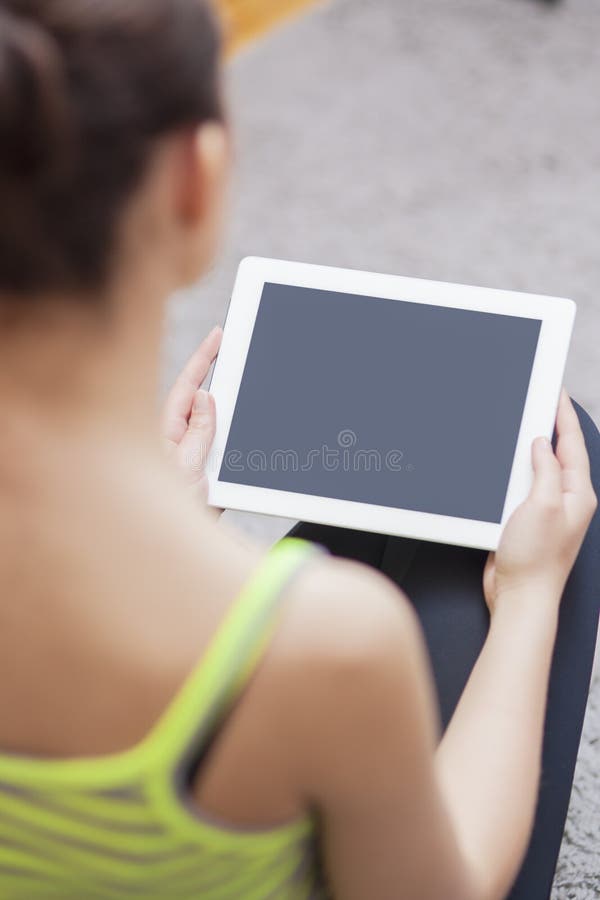 Back View Portrait of Woman Holding Tablet Computer.Focus on Tab Stock ...