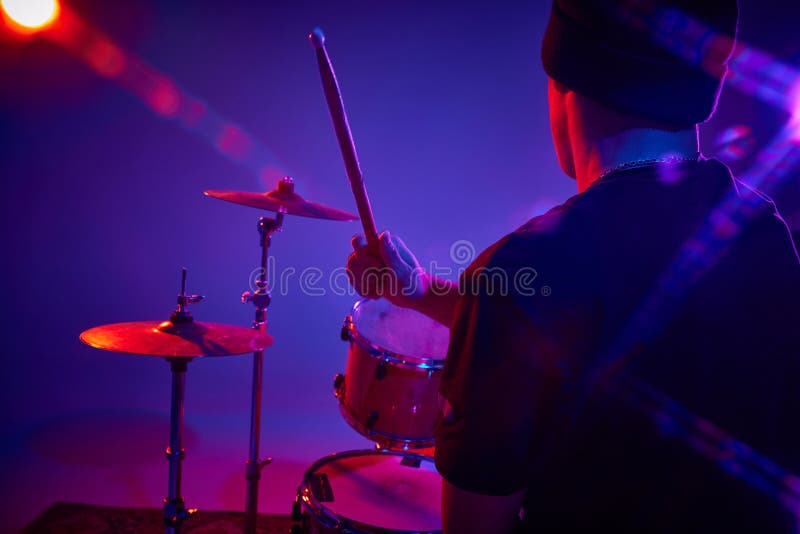 Back View Portrait of Young Artistic Drummer Performing in Pink-purple ...