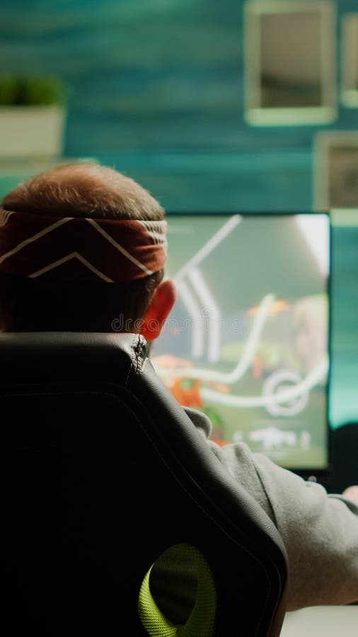 Back View of Pro Gamer Testing New Graphics of FPS Videogame Stock ...