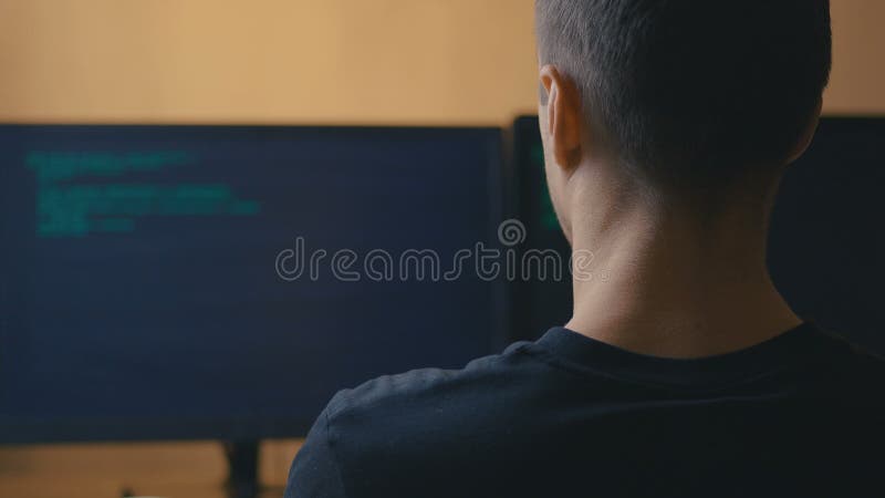 Rear View of it Programmer Engineer Developer Writing Programming Code on Computer Monitor Stock ...