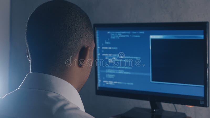 Programming Professional in Action, Male it Programmer Meticulously Crafting Lines of Code on ...