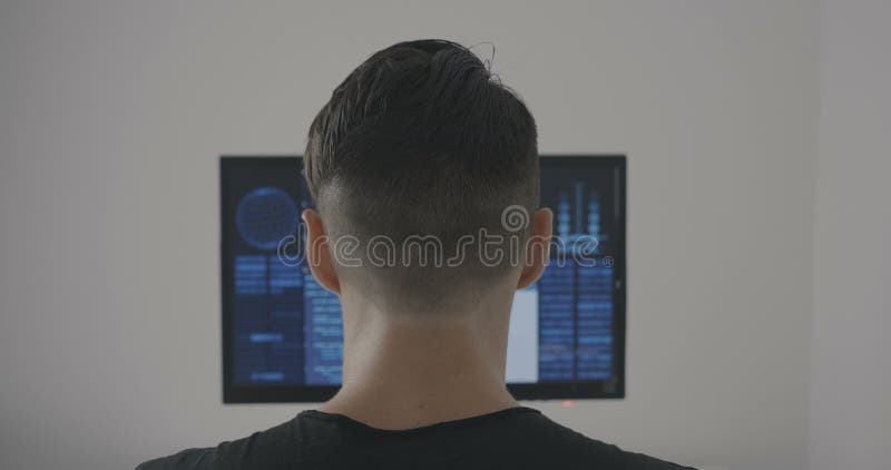 Back View of Man Programmer Working on Computer at Office Stock Footage ...
