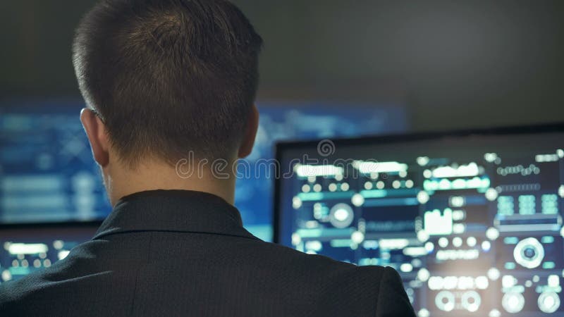 Back View of Programmer Working on Computer in Dark Digital Office ...