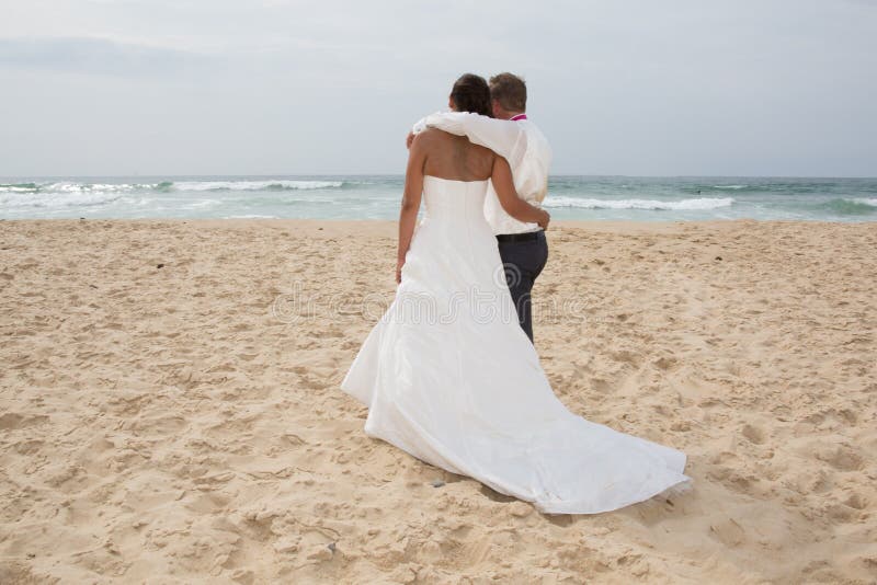 Rear View of Loving Couple Relaxing on Beach, Kissing Outdoors, Stock ...