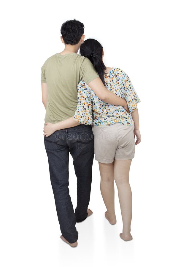 Back View Of Young Couple Hug And Look Into The Distance. Stock Image ...