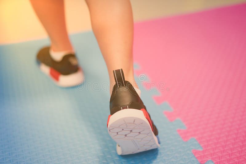Back View of Running Shoes Stop Motion Walking with Sun Flare Stock ...