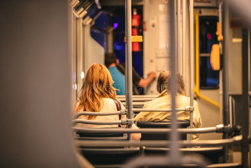 Back View Shot of Two Female Passengers Sitting on a Metro Train Seats ...