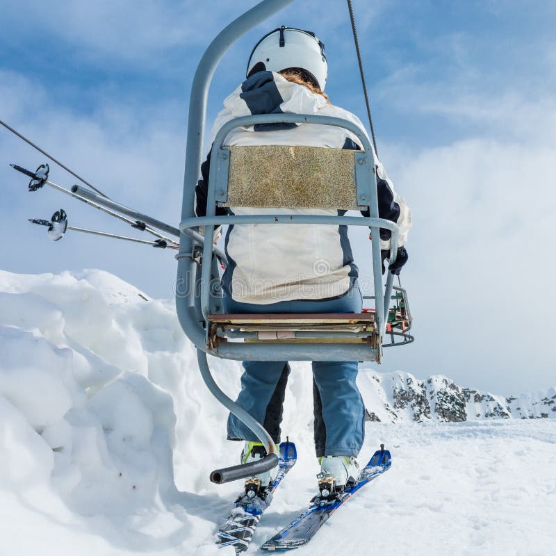 Back View of Skier Riding a Lift. Stock Image - Image of lifestyle ...