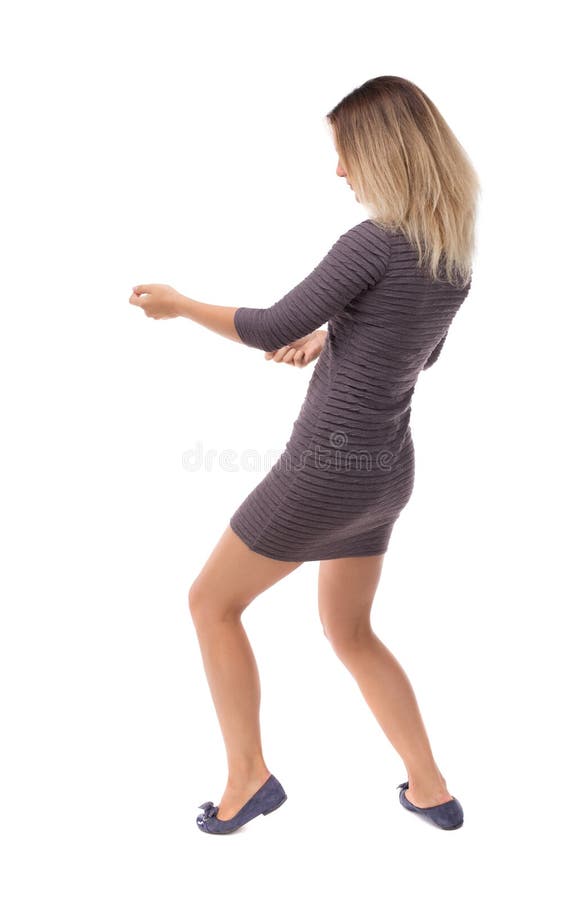 Back View of Standing Girl Pulling a Rope from the Top or Cling Stock ...