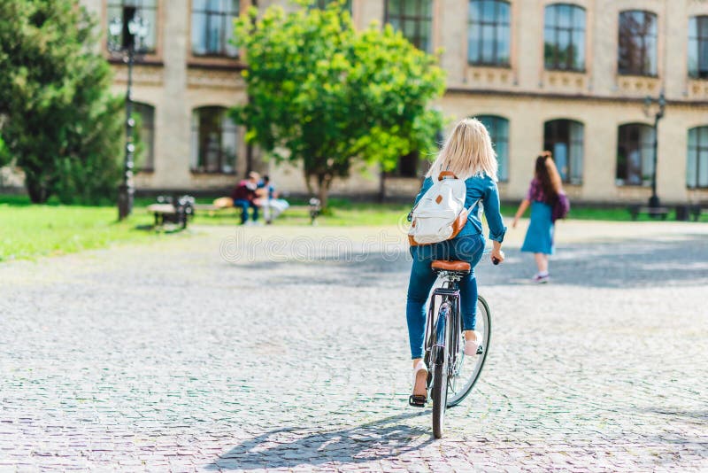 Back View of Student with Backpack Riding Bicycle Stock Photo - Image ...