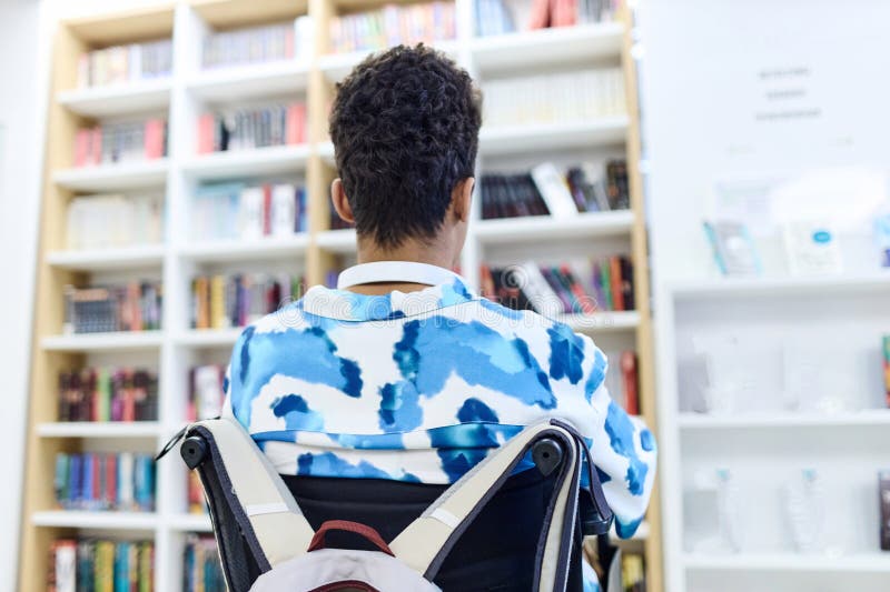 Back View of Student with Disability Stock Image - Image of bookcase ...
