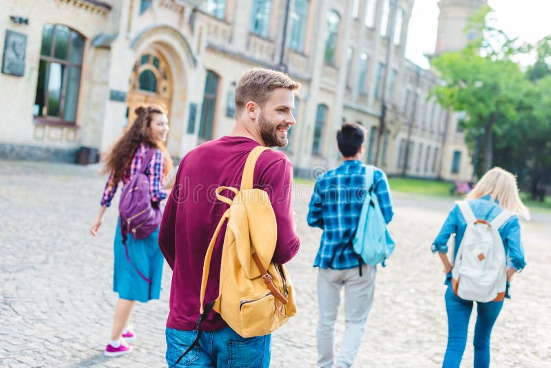 Back View of Students with Backpacks Walking Stock Image - Image of ...