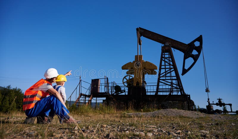 Oilman Showing Little Boy at Oil Extraction Station. Stock Image ...