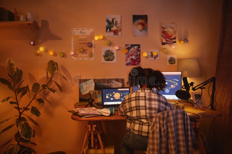 Teen Black Girl Smiling at Camera Sitting by Computer at Home Stock ...
