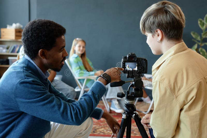 Teenage Boy Setting Up Camera Stock Photo - Image of studio, stand ...
