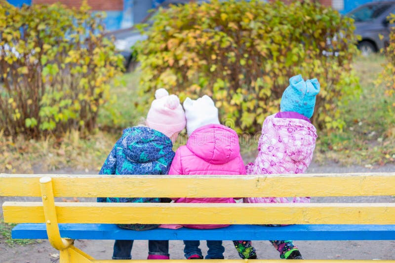 Back View of Three Girl Friends on a Park Bench Stock Photo - Image of ...