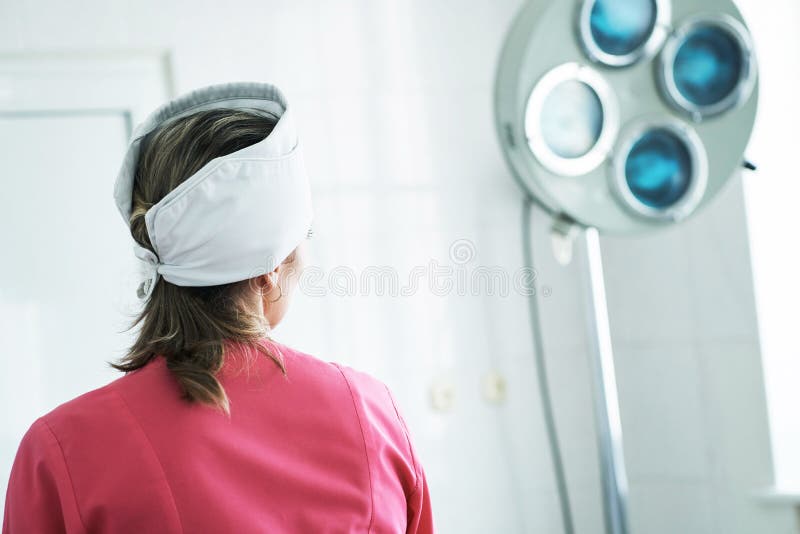 Tired Female Medical Doctor in White Medical Dressing Gown Waiting for ...