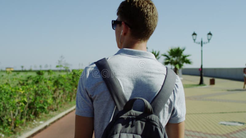 Back View of Traveller Walking on the Street and Looking at Sights ...