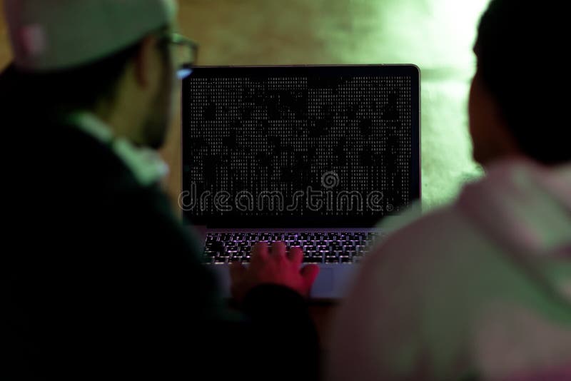 Back View of Two Diverse Male Colleagues at Desk Using Computer with Coding on Screen Stock ...