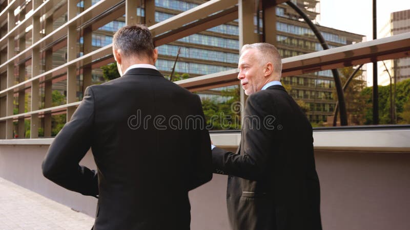 Two Executives Walking and Discussing Business Outside Stock Video ...