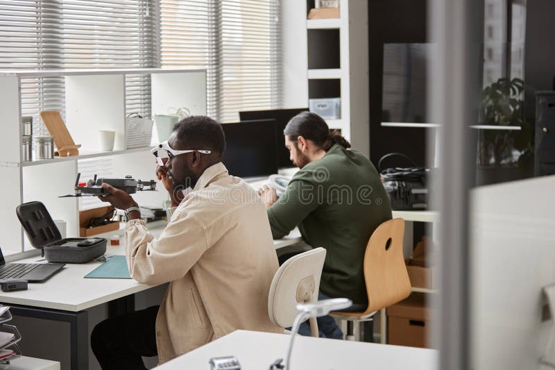 Back View at Two People Fixing Electronics in Tech Repair Shop Stock ...