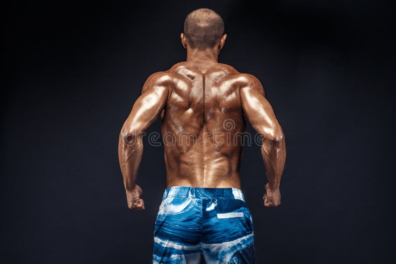 Back View of Unrecognizable Man, Strong Muscles Posing with Arms Down ...
