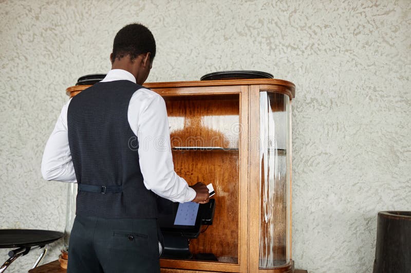 Back View of Waiter Using Computer System in Restaurant and Putting ...