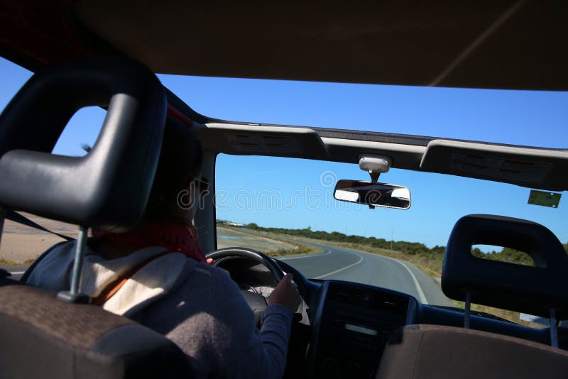Back View of Woman Driving Car on Empty Road Stock Image - Image of ...