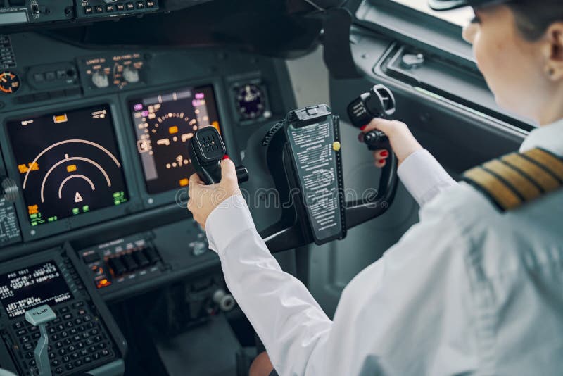 Professional Female Pilot is Navigating an Airplane Stock Image - Image ...
