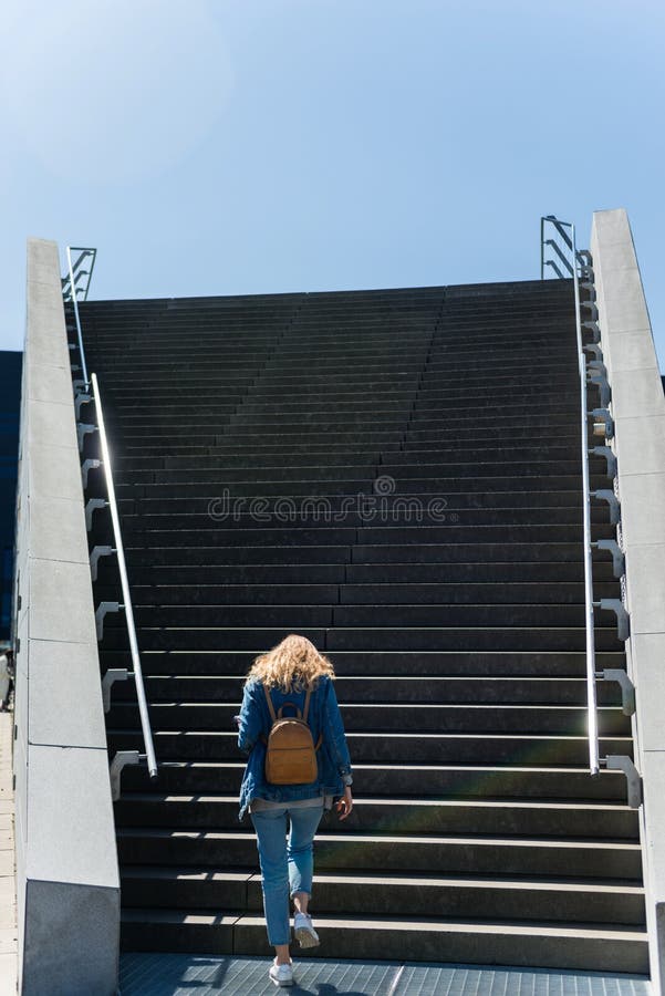 Back View of Woman Going Up on Steps Stock Photo - Image of backpacker ...