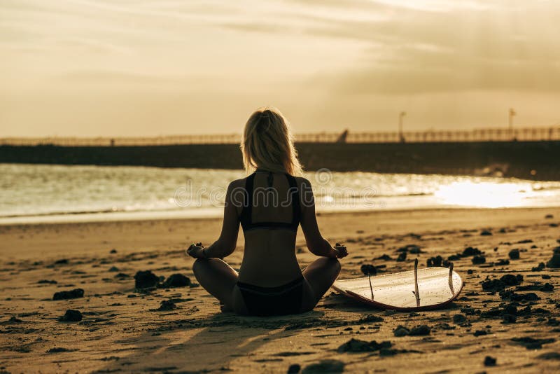 Back View of Woman Meditating on Beach at Sunset Stock Image - Image of ...