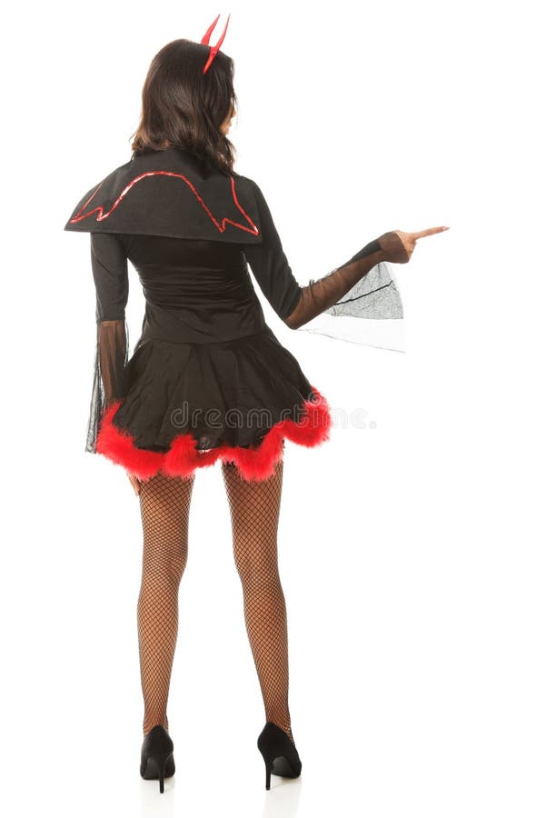 Back View of Woman Pointing Right Wearing Devil Clothes Stock Photo ...
